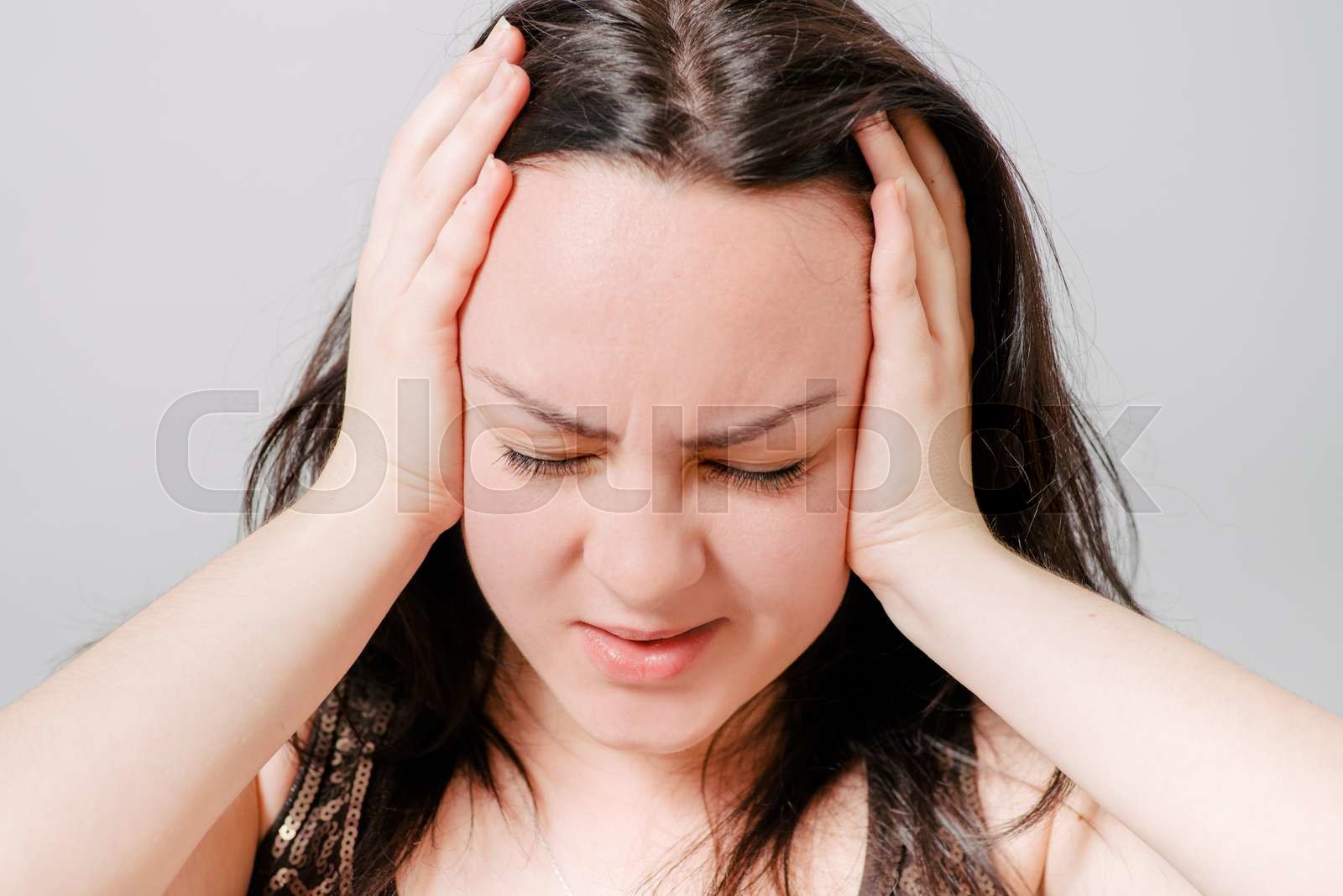 Girl has headache | Stock image | Colourbox