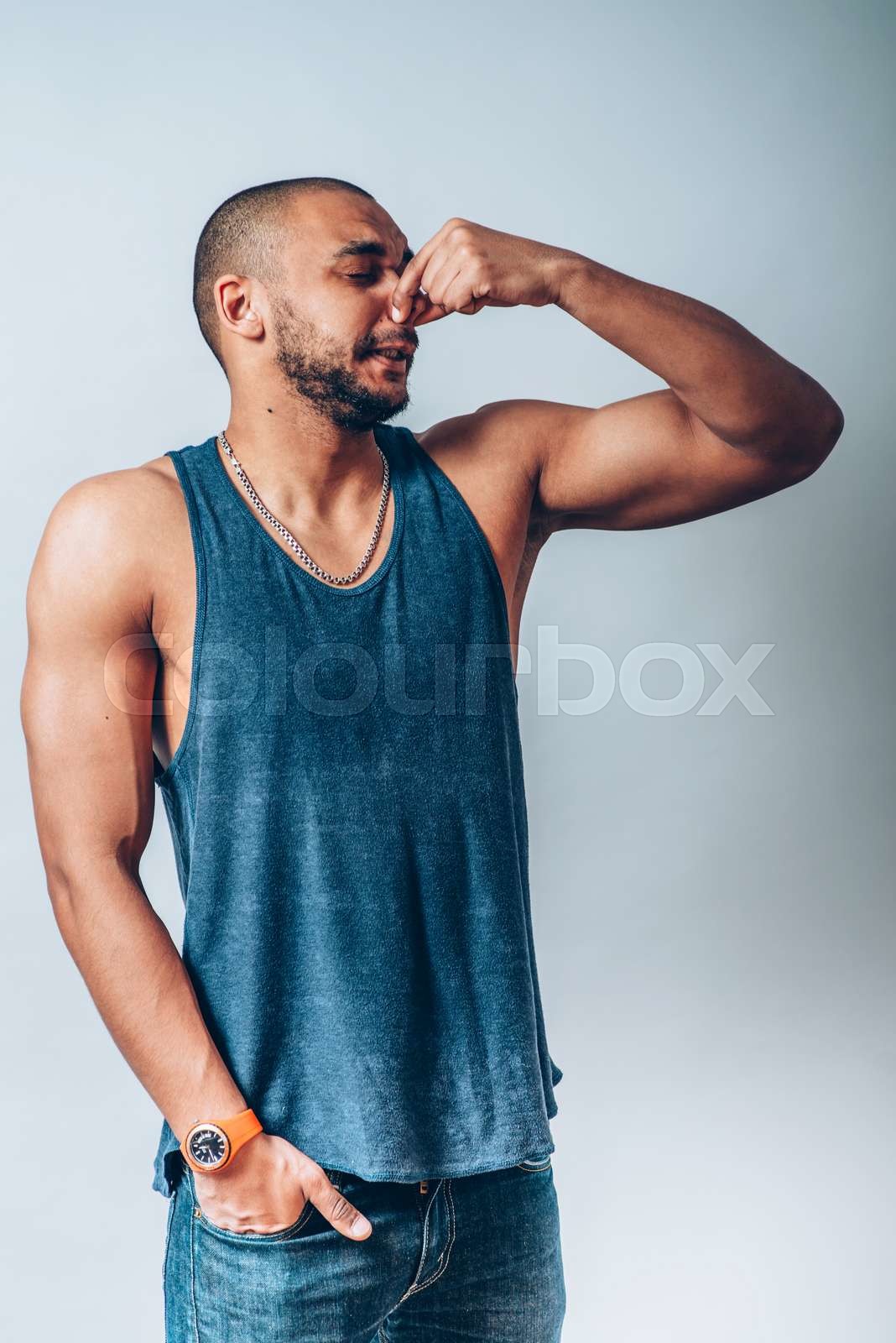 man closes nose hand | Stock image | Colourbox