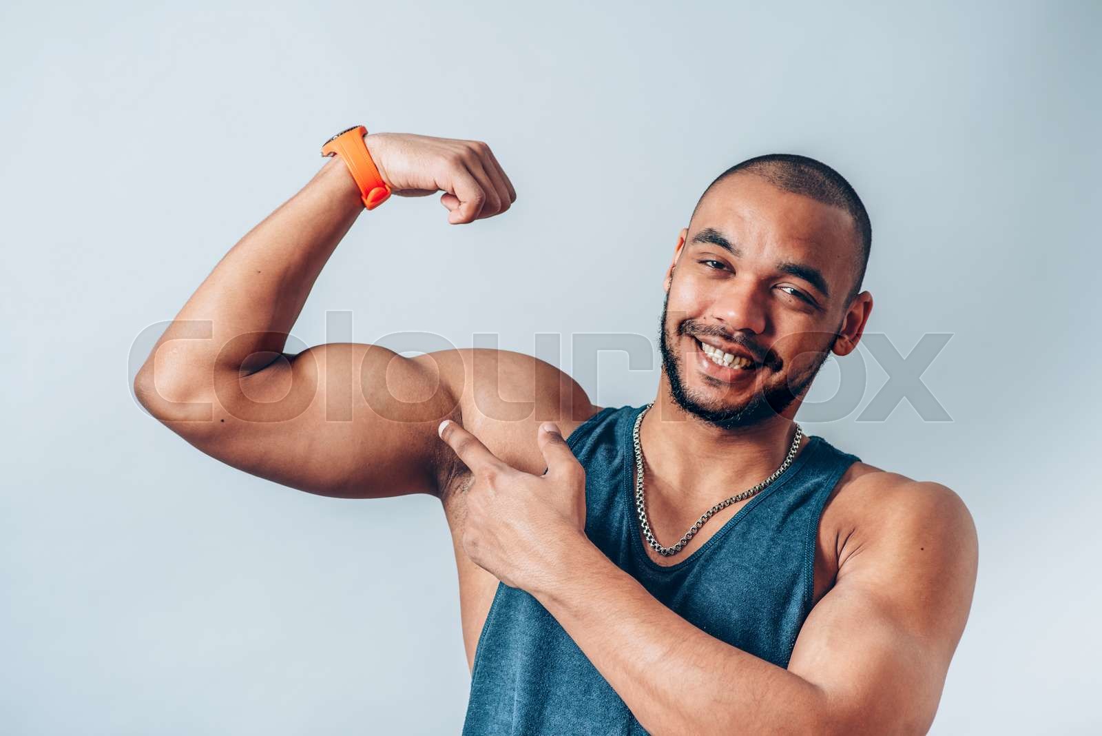 man shows biceps | Stock image | Colourbox
