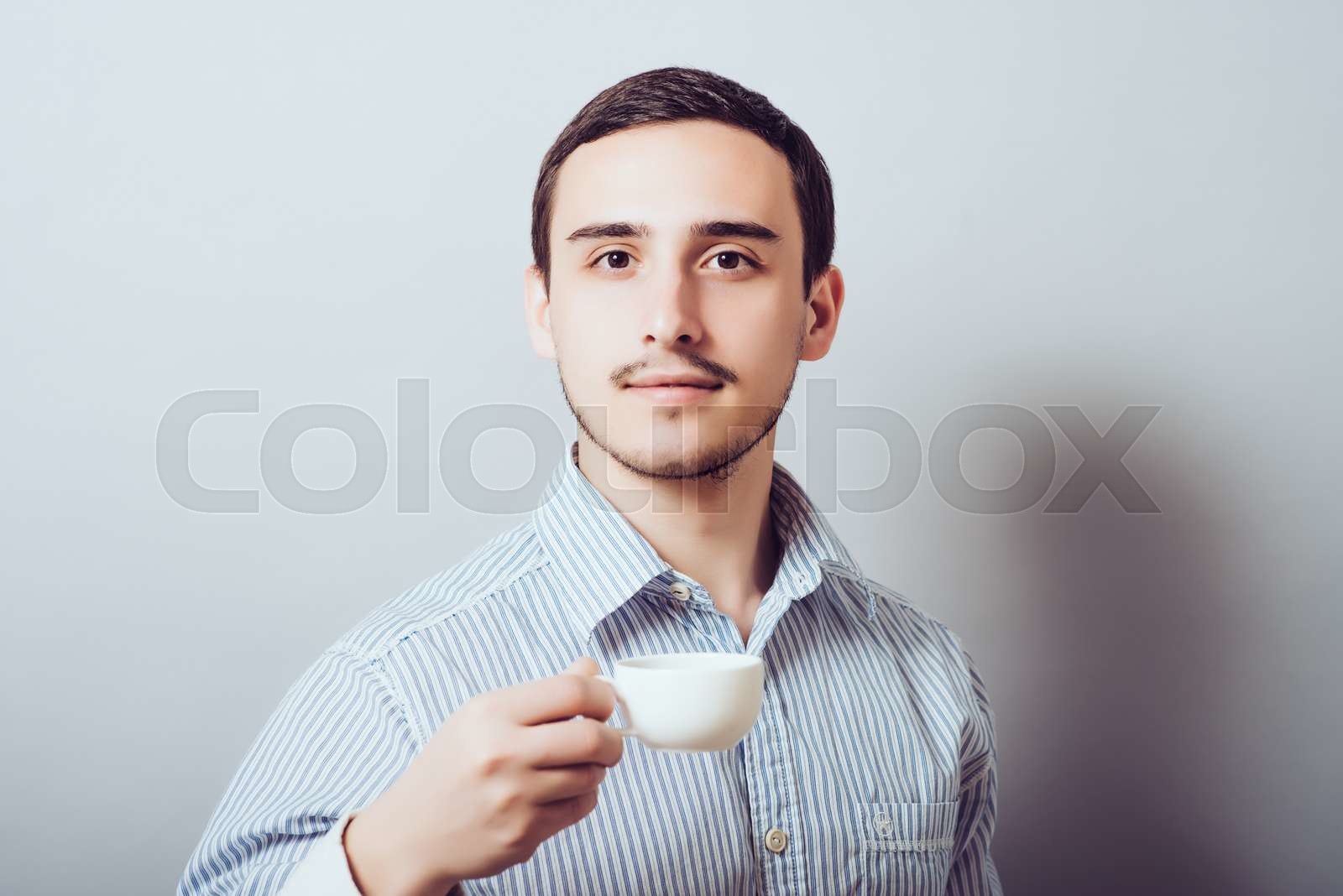Men drinking coffee. Close-up of men | Stock image | Colourbox