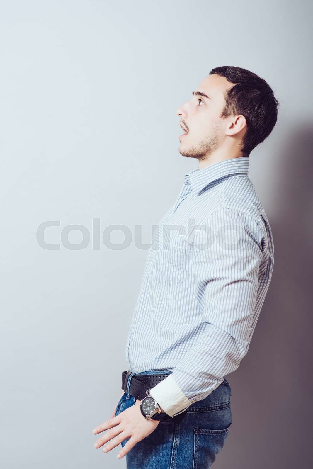 portrait of man standing back in profile | Stock image | Colourbox