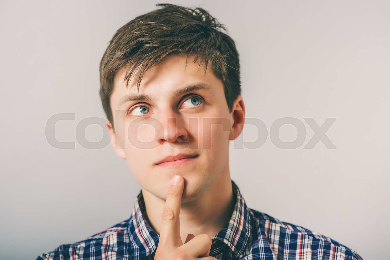Man making a hard decision, thinking hard | Stock image | Colourbox