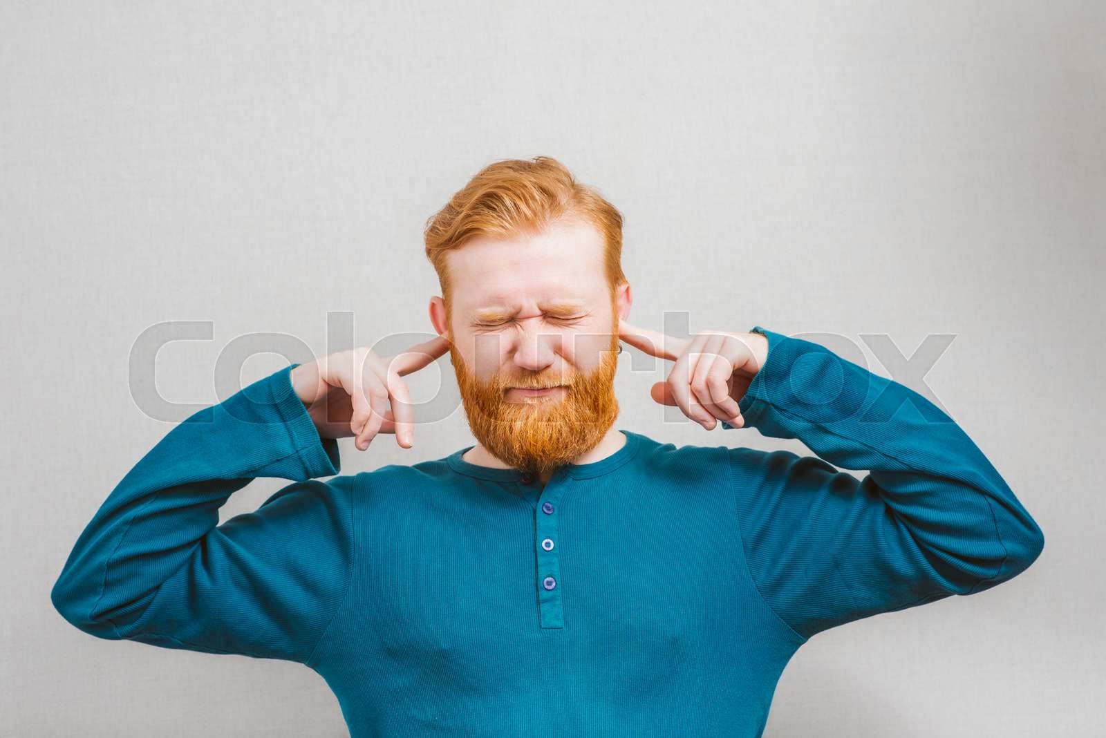 man covers his ears | Stock image | Colourbox