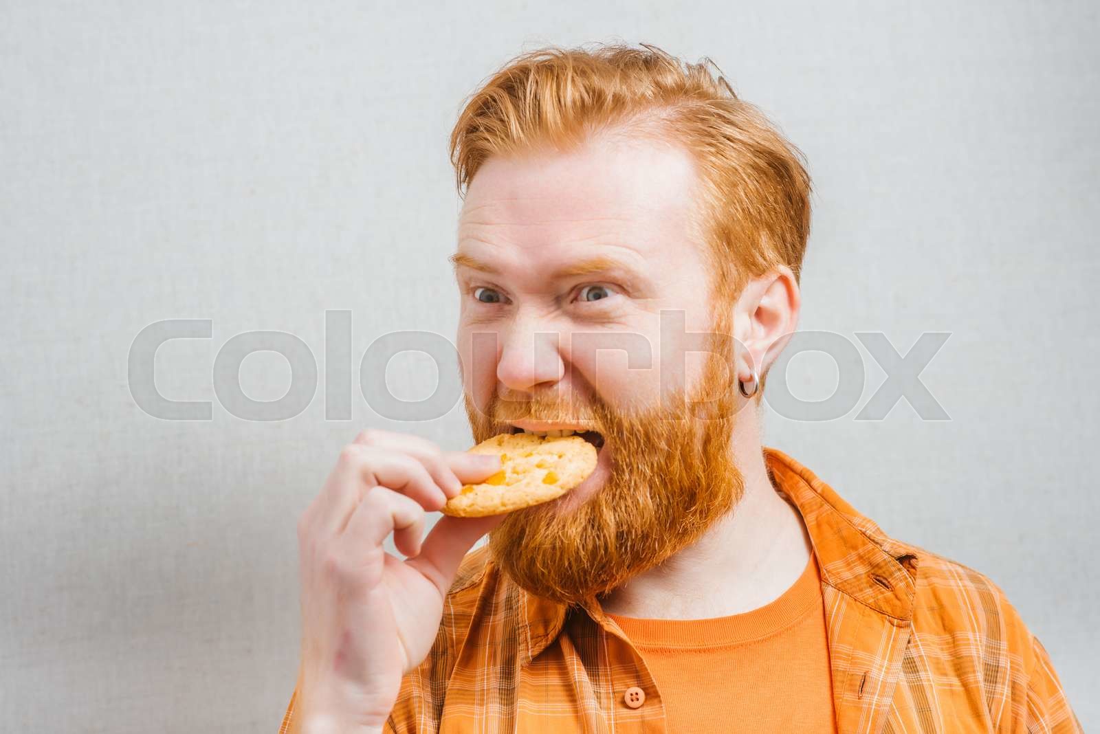 Man eating cookies | Stock image | Colourbox