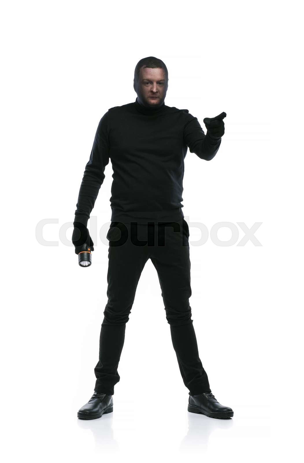 Thief in black mask | Stock image | Colourbox