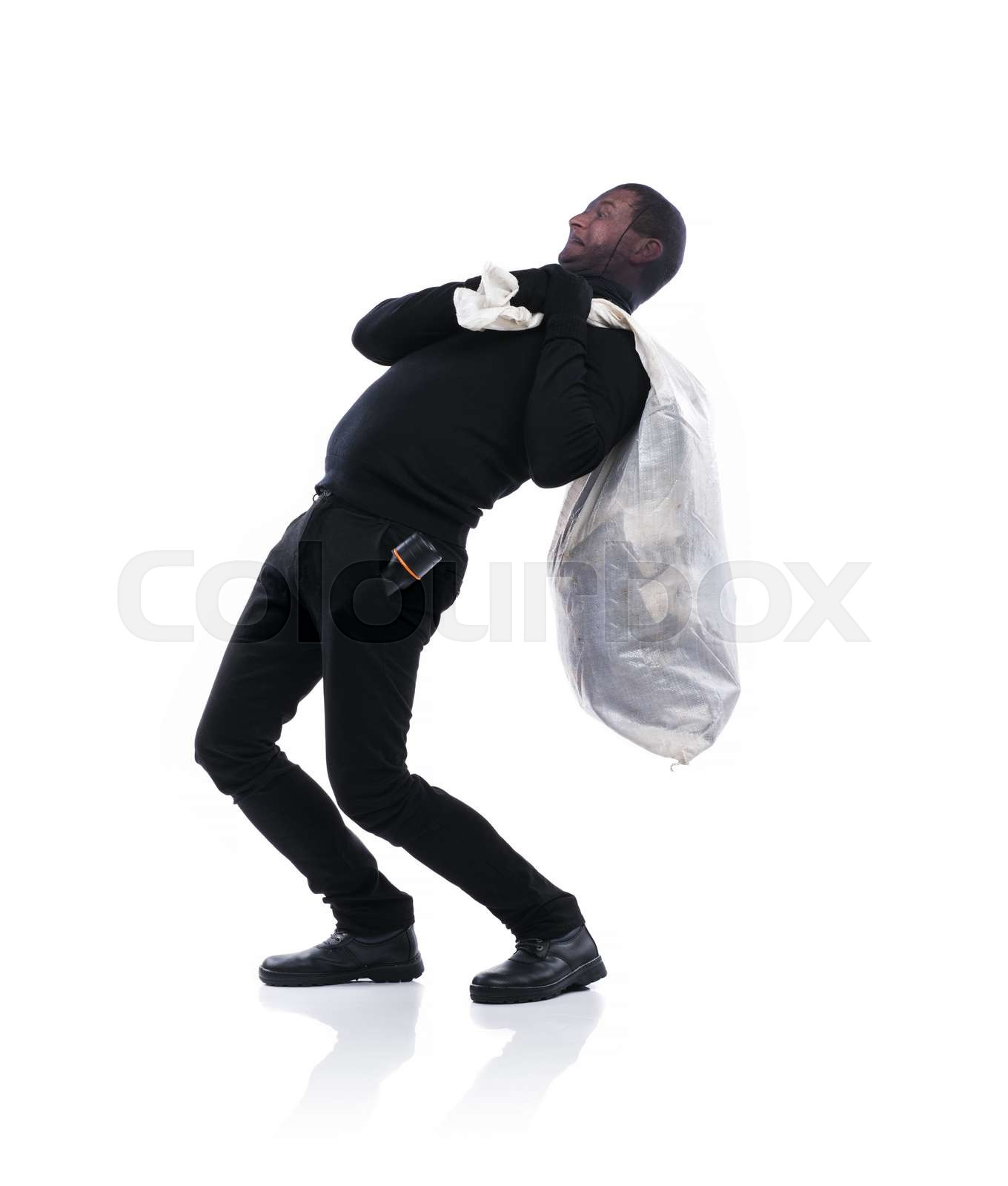 Thief in black mask | Stock image | Colourbox
