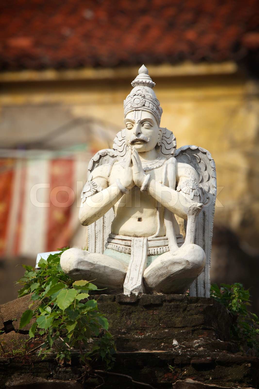 Stone Garuda (bird deity) statue | Stock image | Colourbox