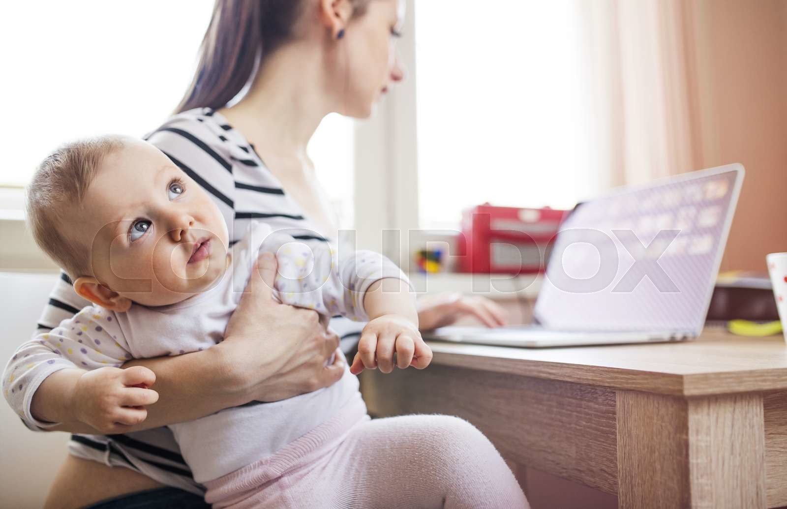 Young mother working from home | Stock image | Colourbox