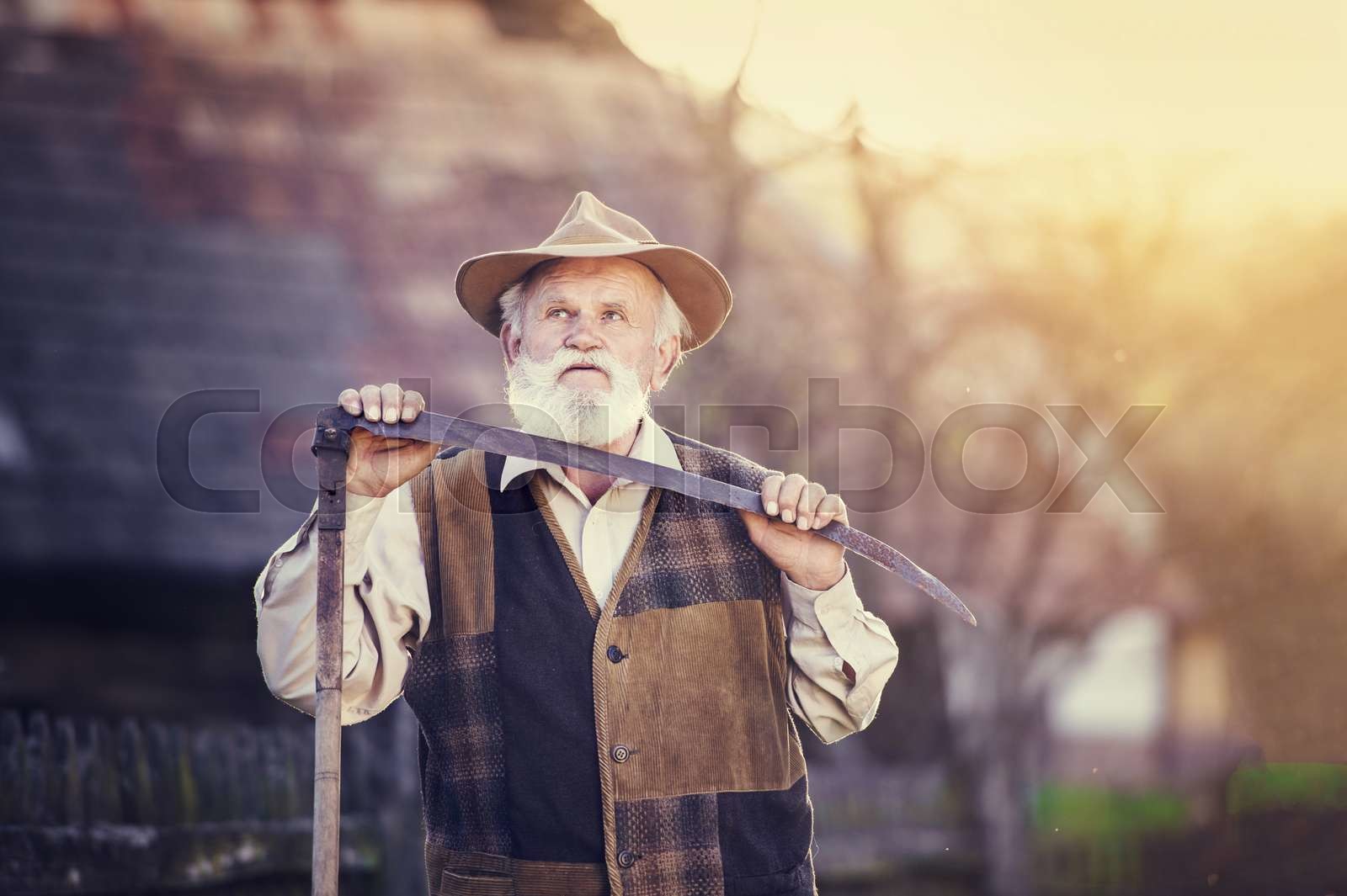 Man with scythe | Stock image | Colourbox