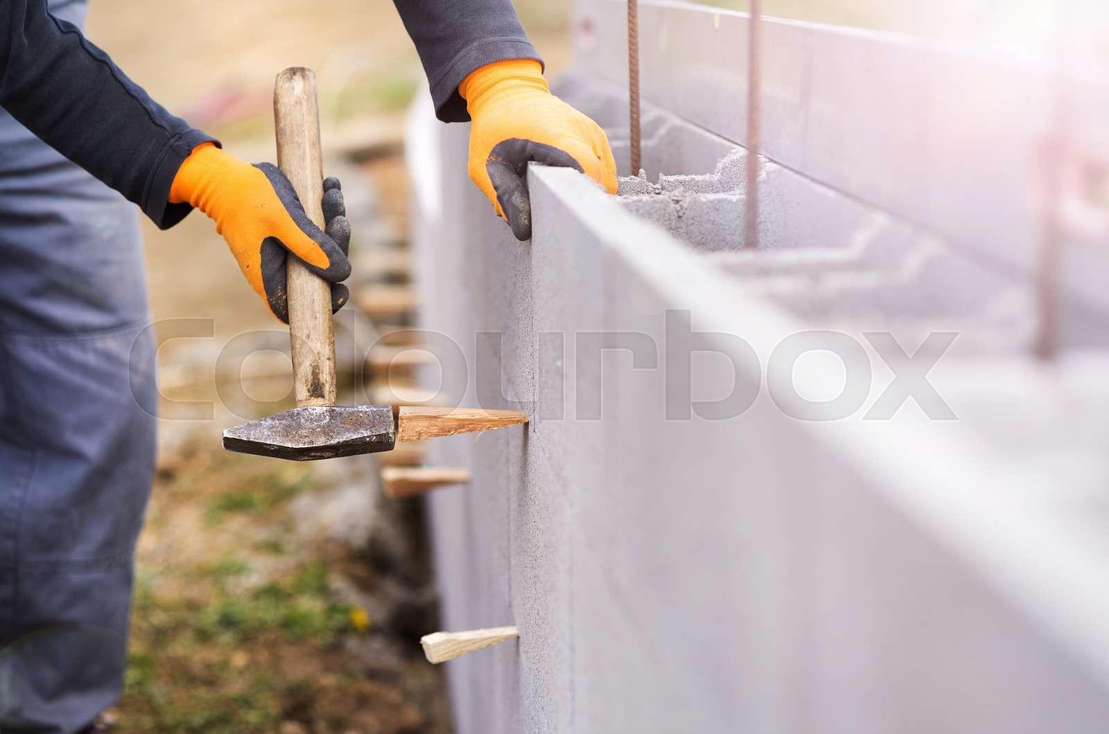 Man building a house | Stock image | Colourbox