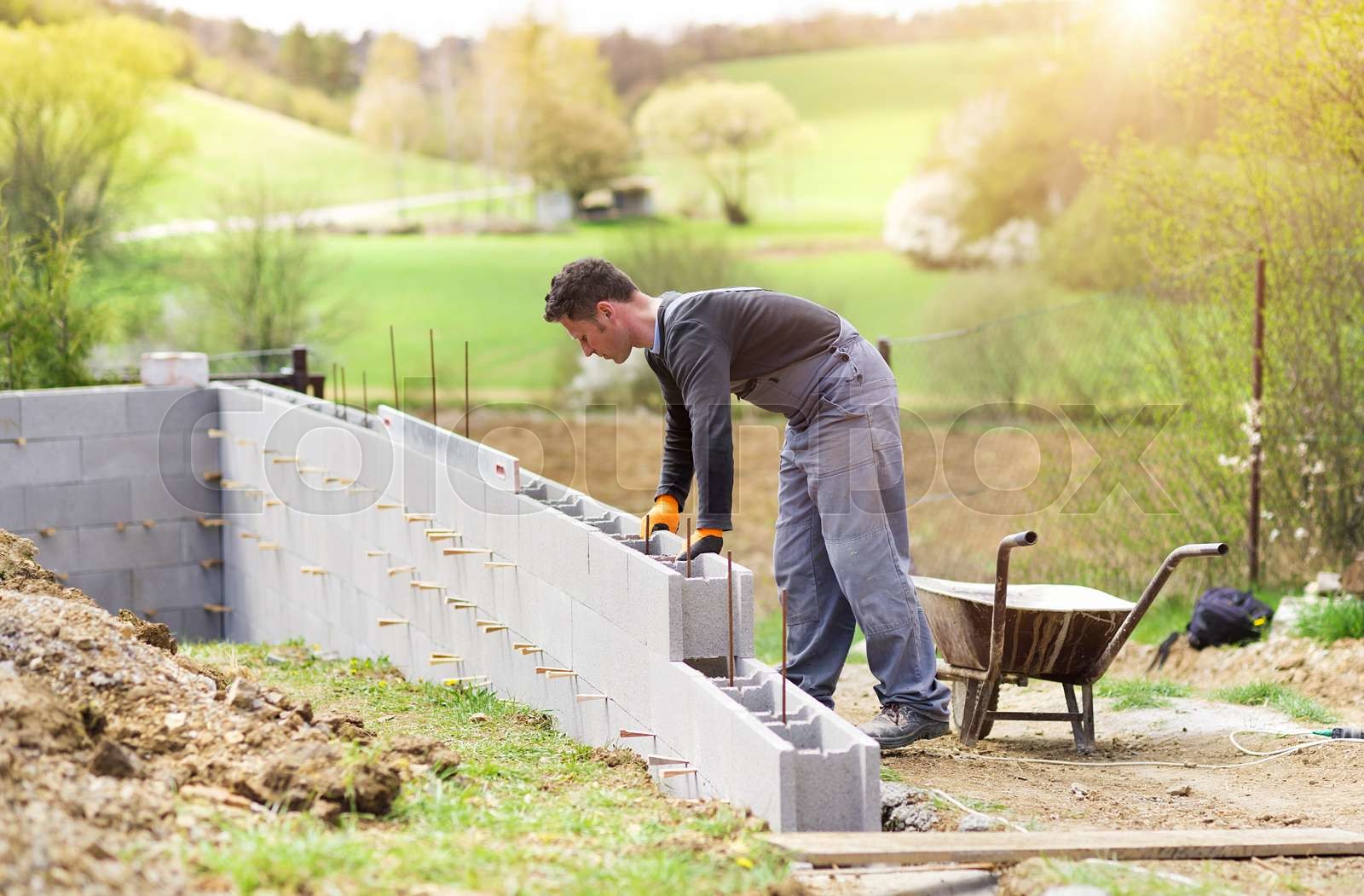 Man building a house | Stock image | Colourbox