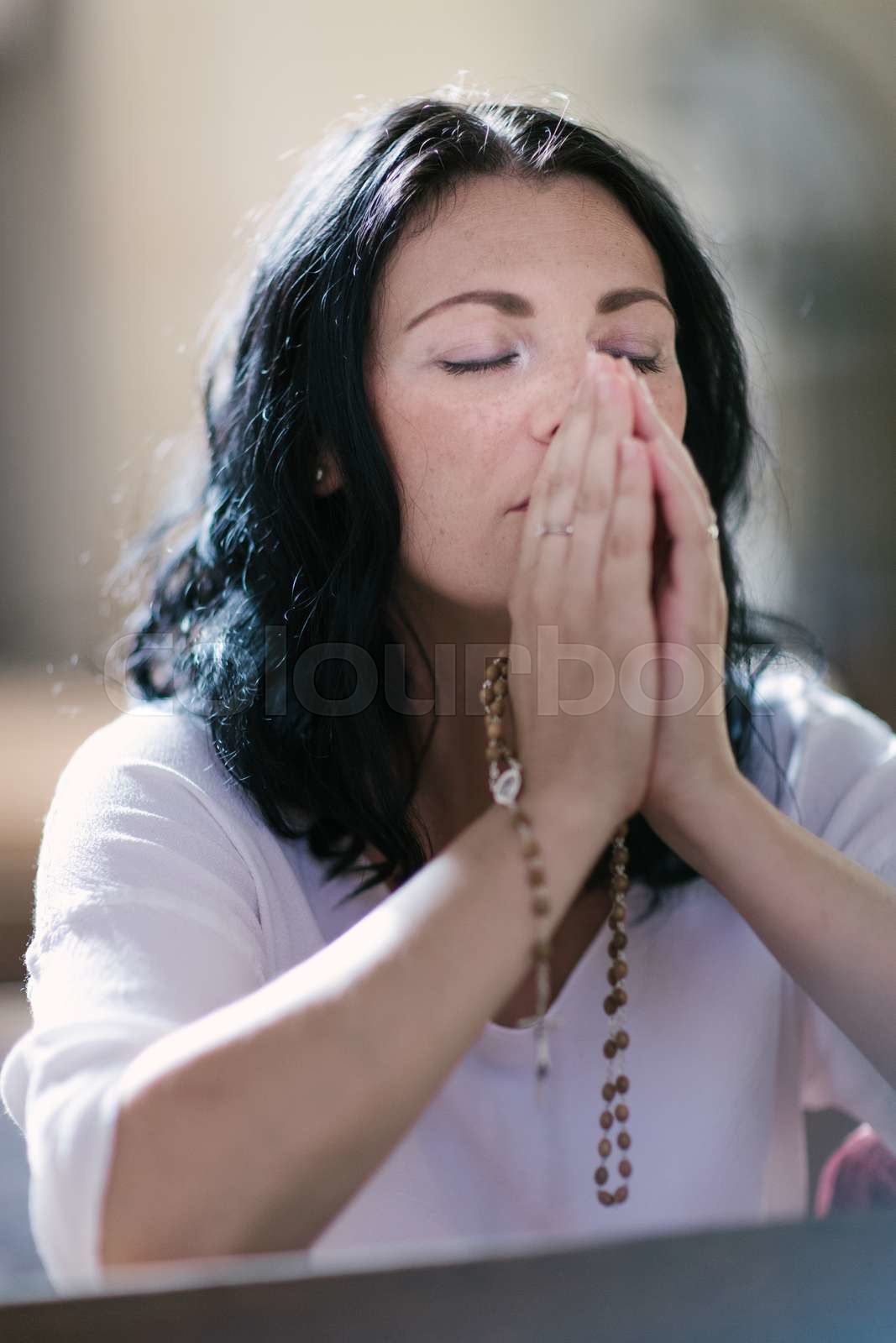 Woman praying | Stock image | Colourbox