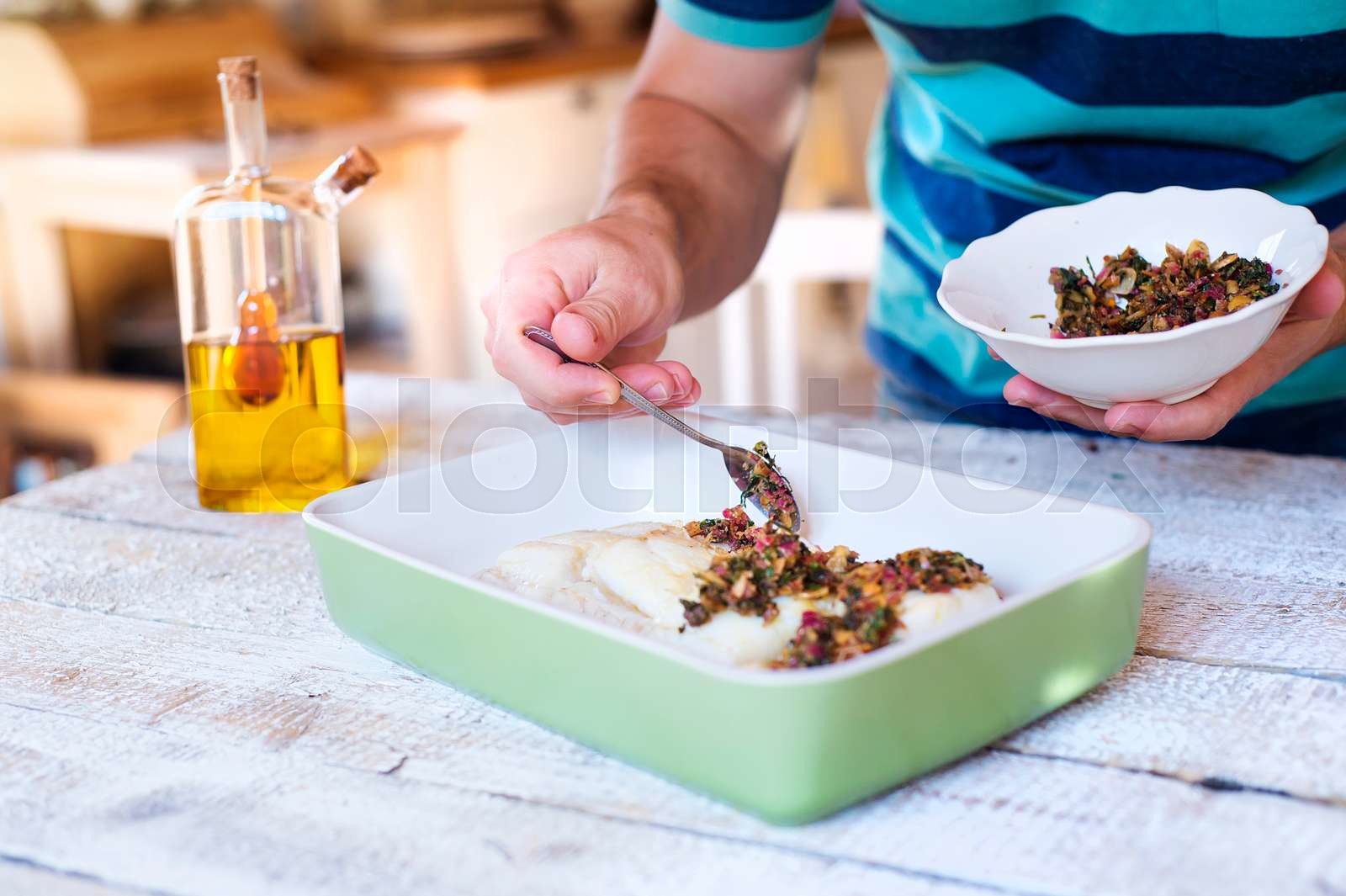 Man preparing fish | Stock image | Colourbox