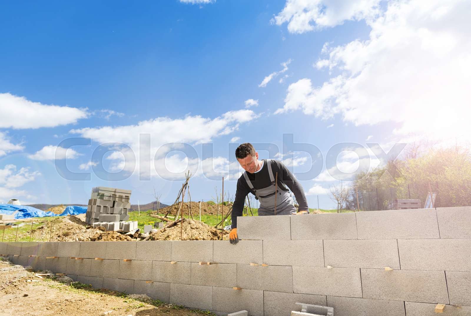 Man building a house | Stock image | Colourbox