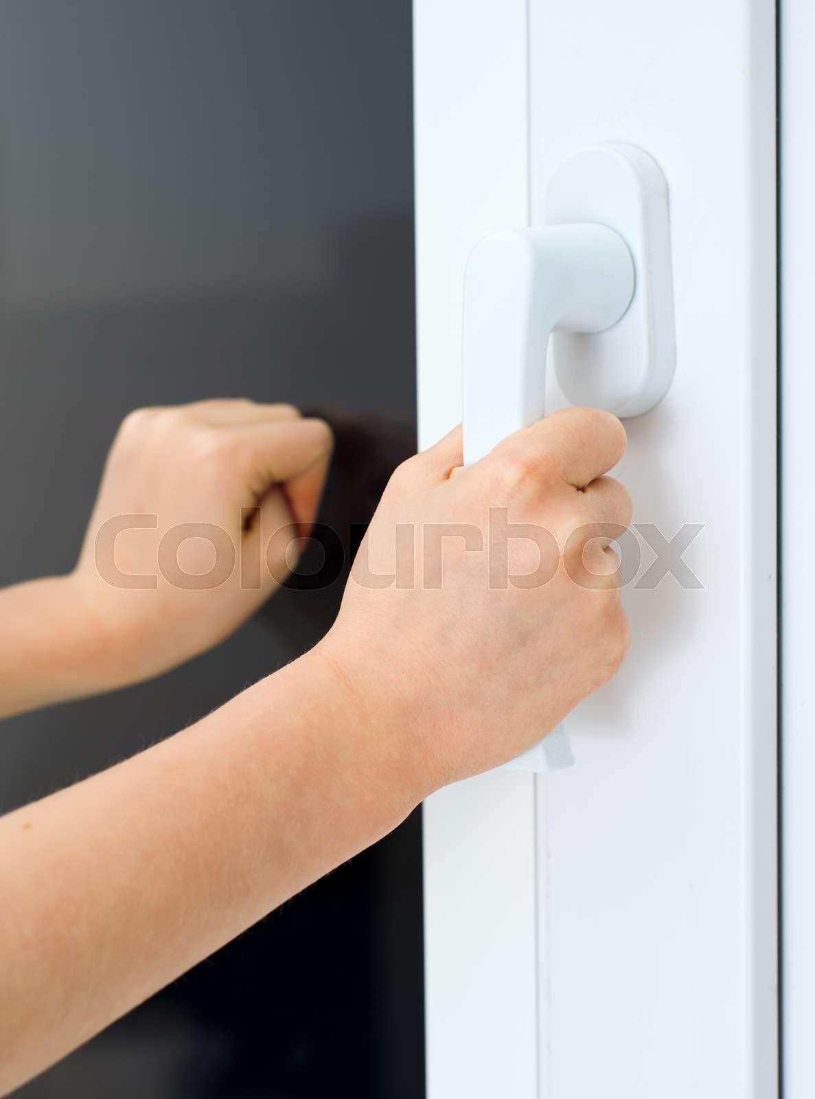 Child tries to open window. Dangerous situation at home. | Stock image ...