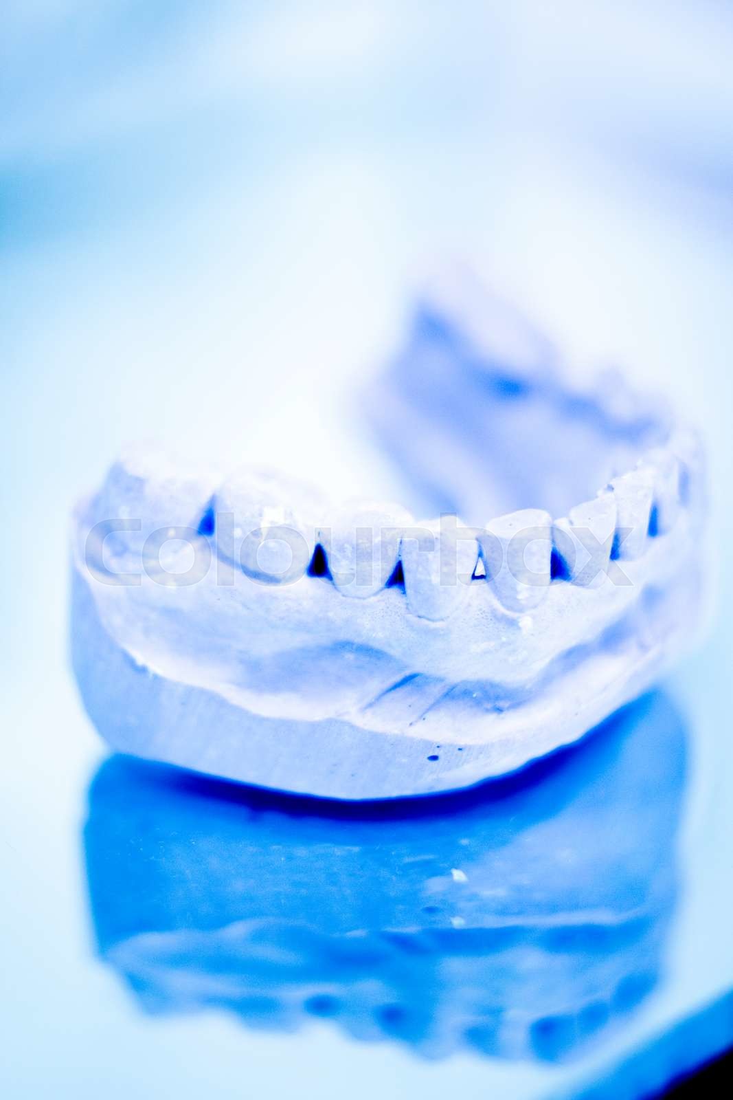 Dental prosthetics clay tooth mold | Stock image | Colourbox