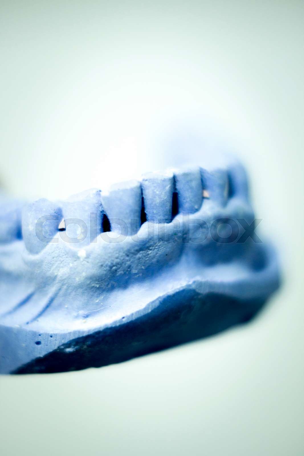 Dental prosthetics clay tooth mold | Stock image | Colourbox