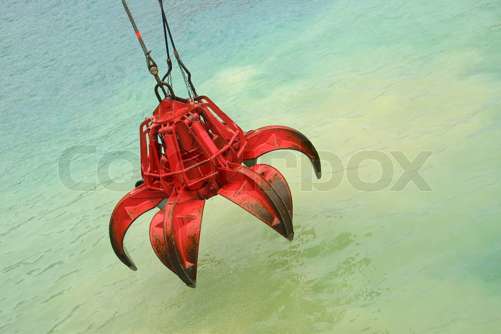 Close-up bucket of crane above the water | Stock image | Colourbox