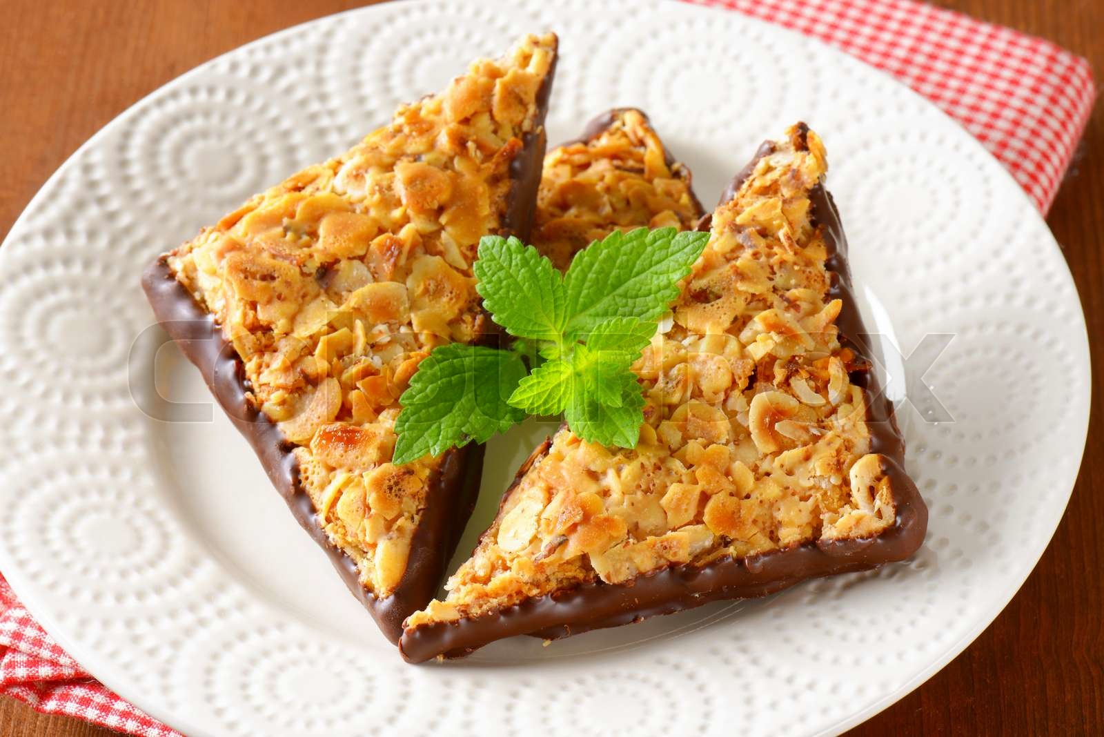 Triangle nut bars dipped in chocolate | Stock image | Colourbox