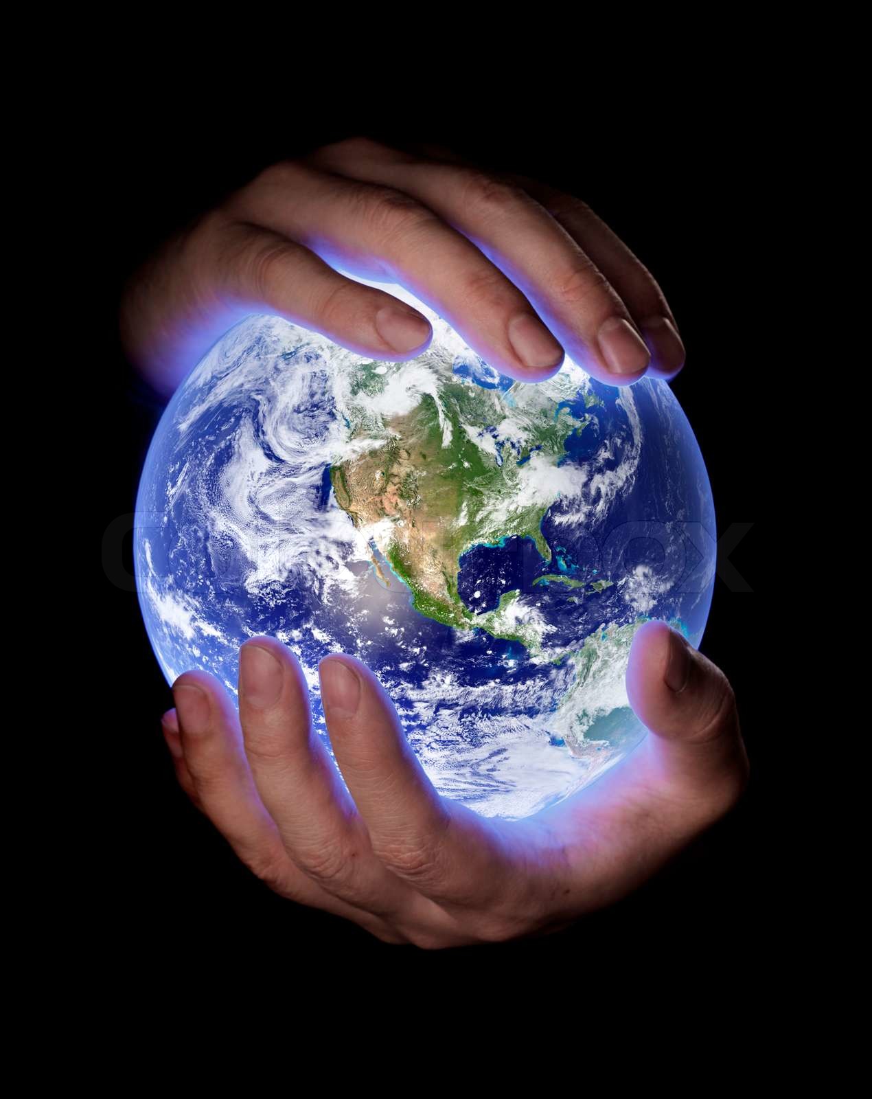 Man holding a glowing earth globe in his hands. Earth image provided by ...