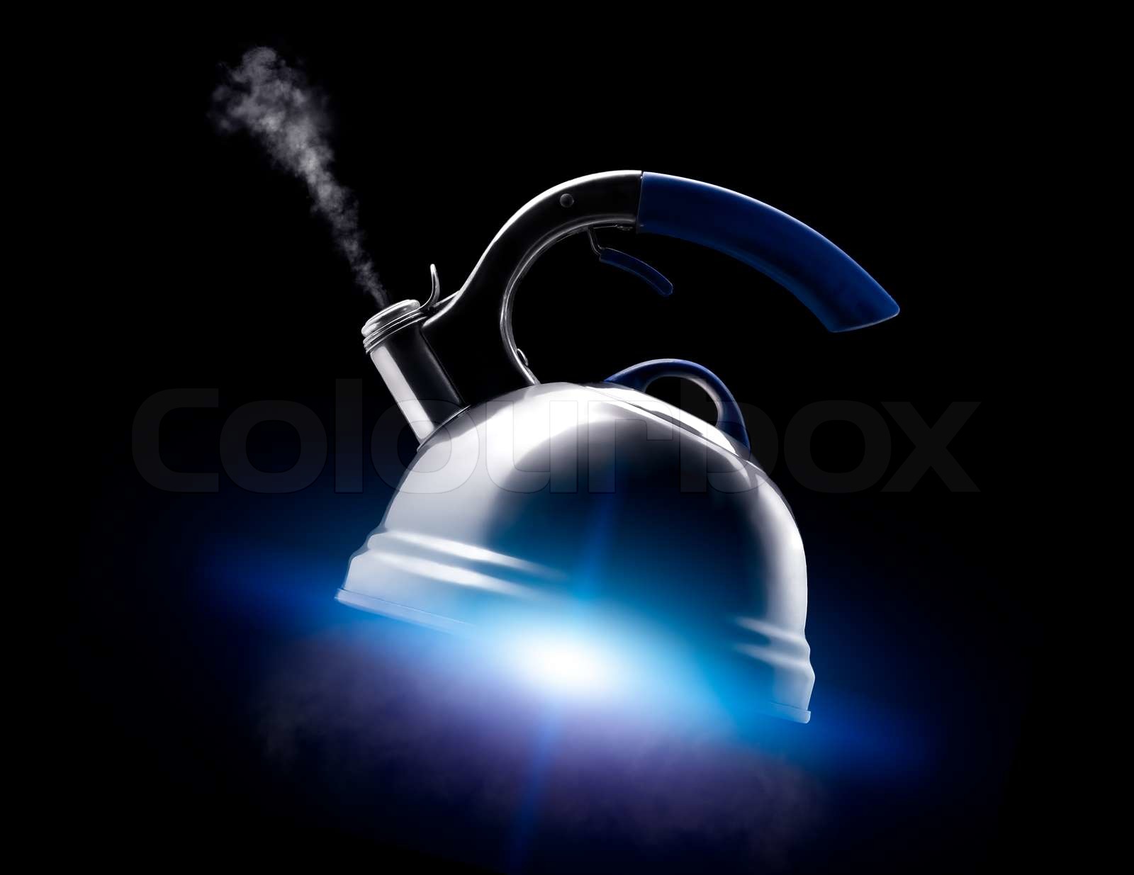 Tea kettle with boiling water on black background. Blue glow like from ...
