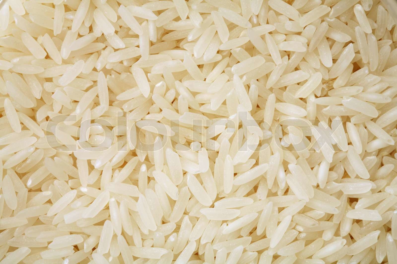 Uncooked rice texture | Stock image | Colourbox