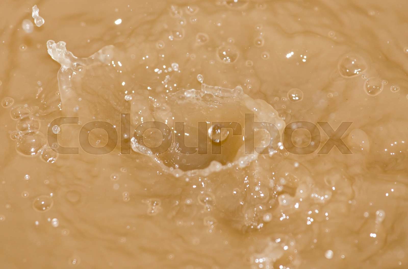 Drops of water falling into the dirty water | Stock image | Colourbox