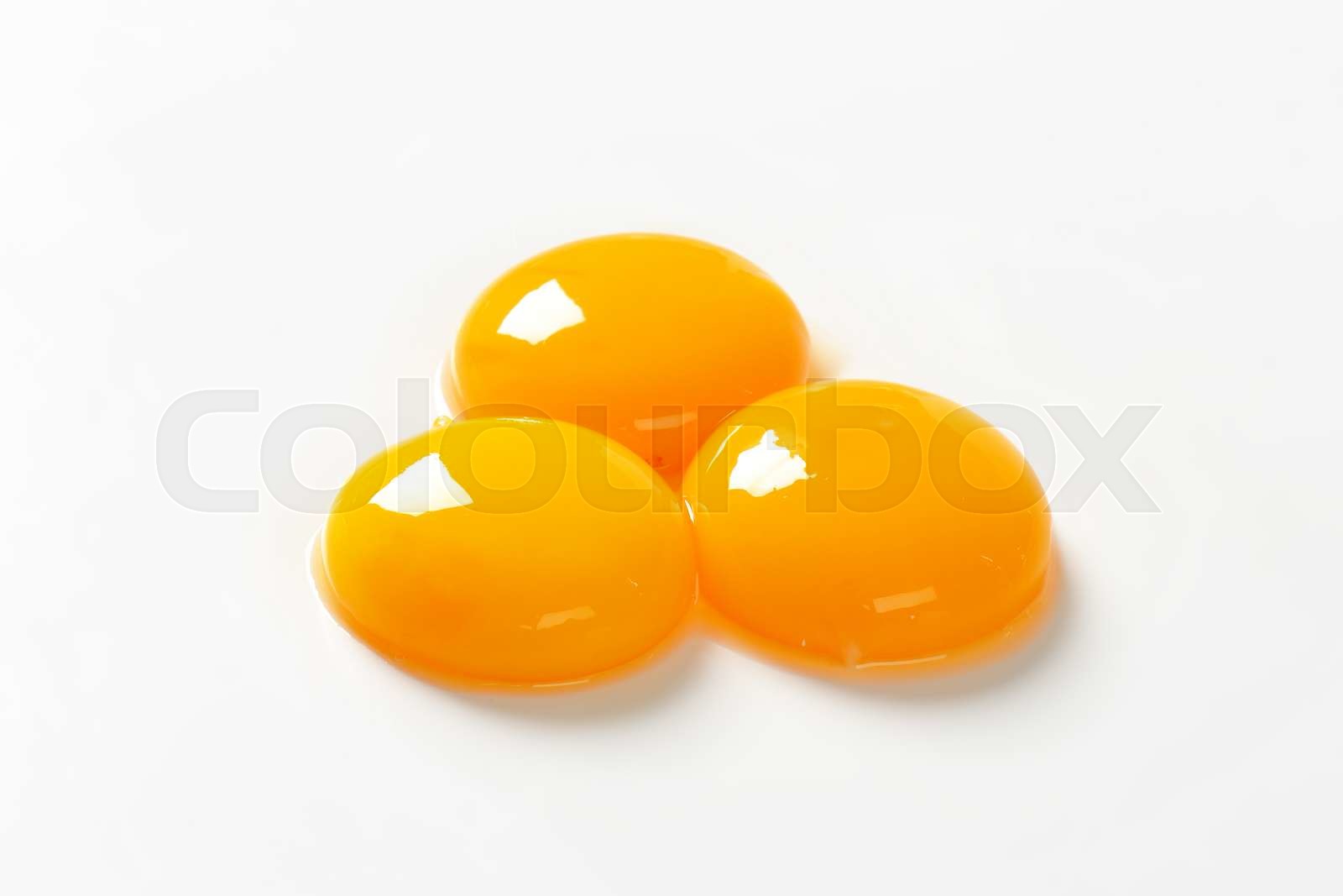 Raw egg yolks | Stock image | Colourbox