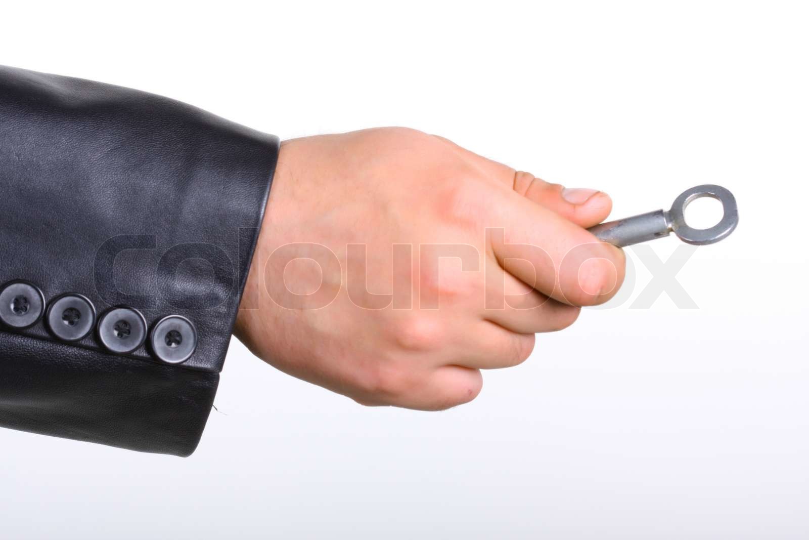 Man with key on hand | Stock image | Colourbox