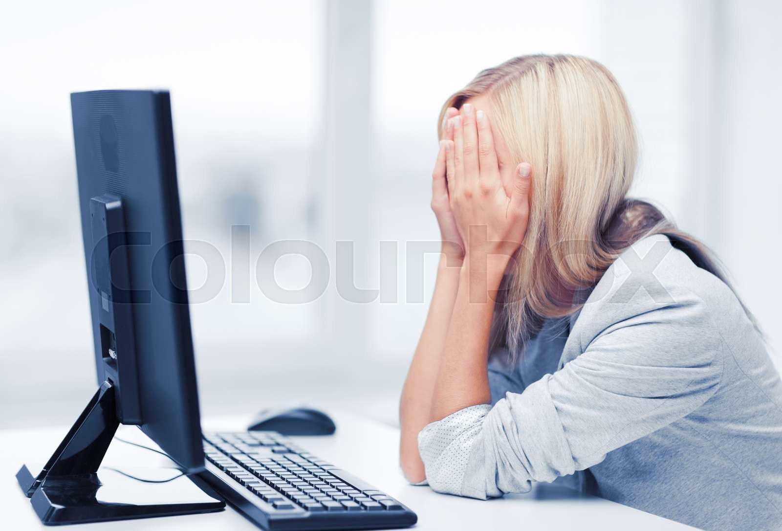stressed woman with computer | Stock image | Colourbox