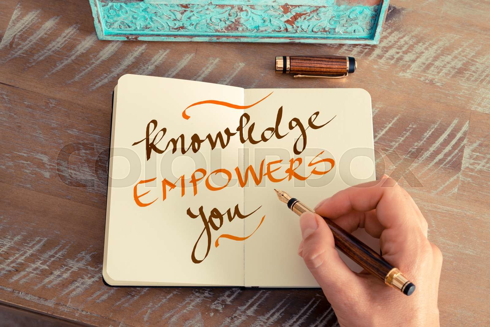 Handwritten text KNOWLEDGE EMPOWERS YOU | Stock image | Colourbox
