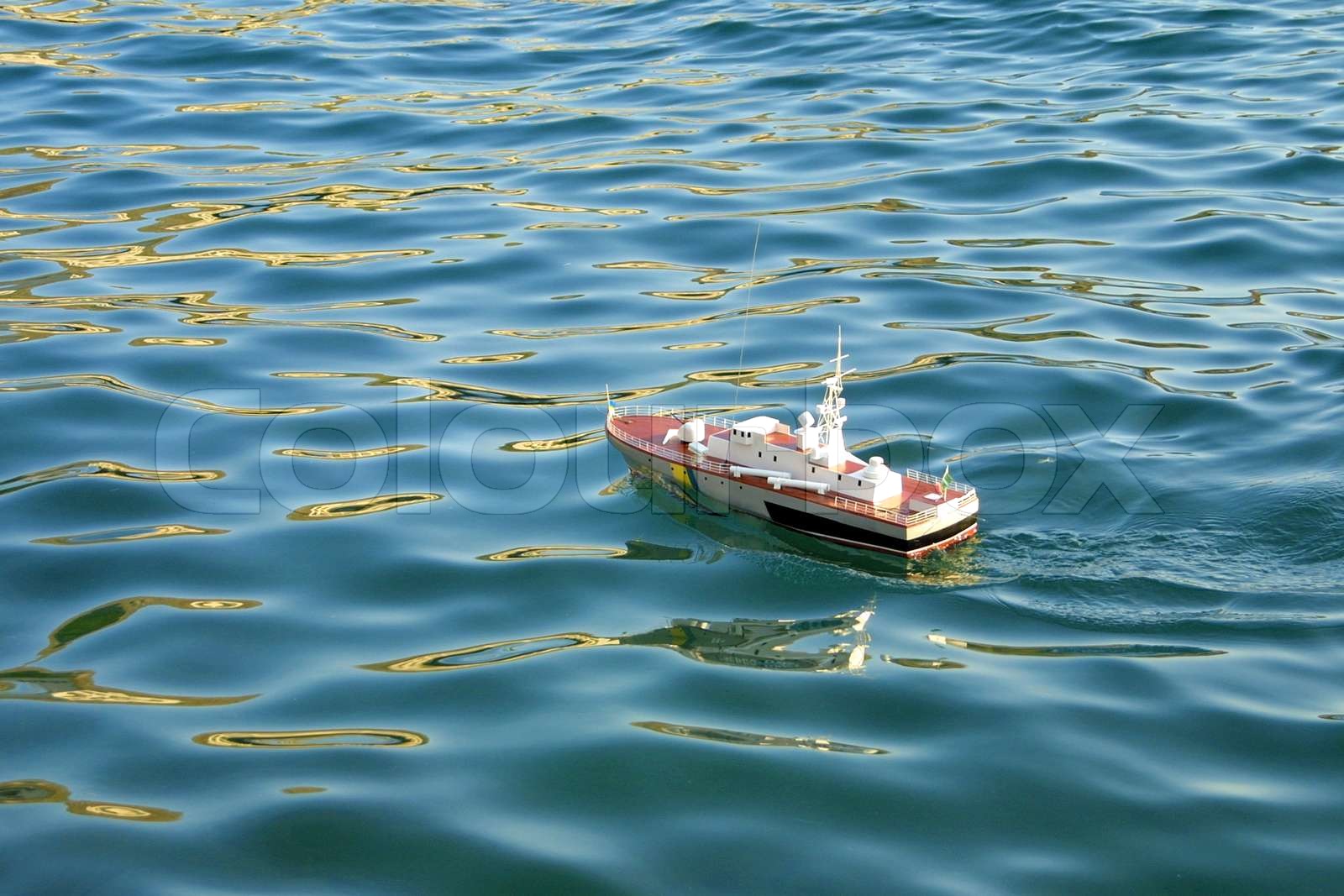 Toy ship floating on the water | Stock image | Colourbox