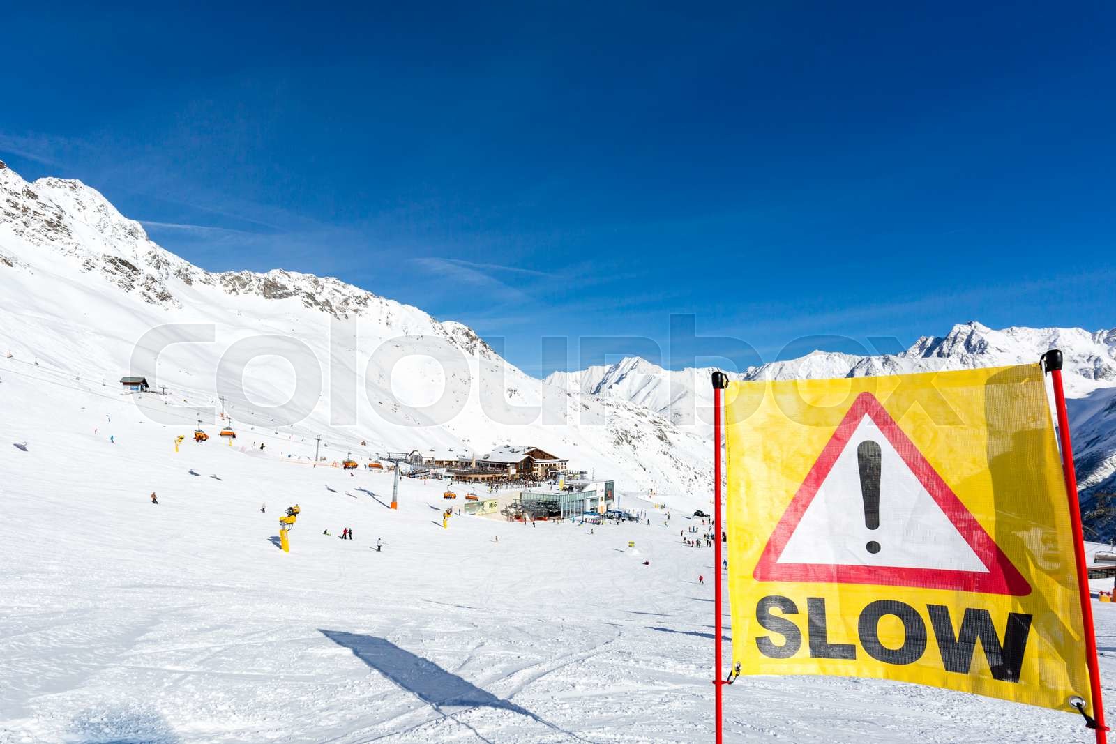 Yellow slow down warning sign | Stock image | Colourbox