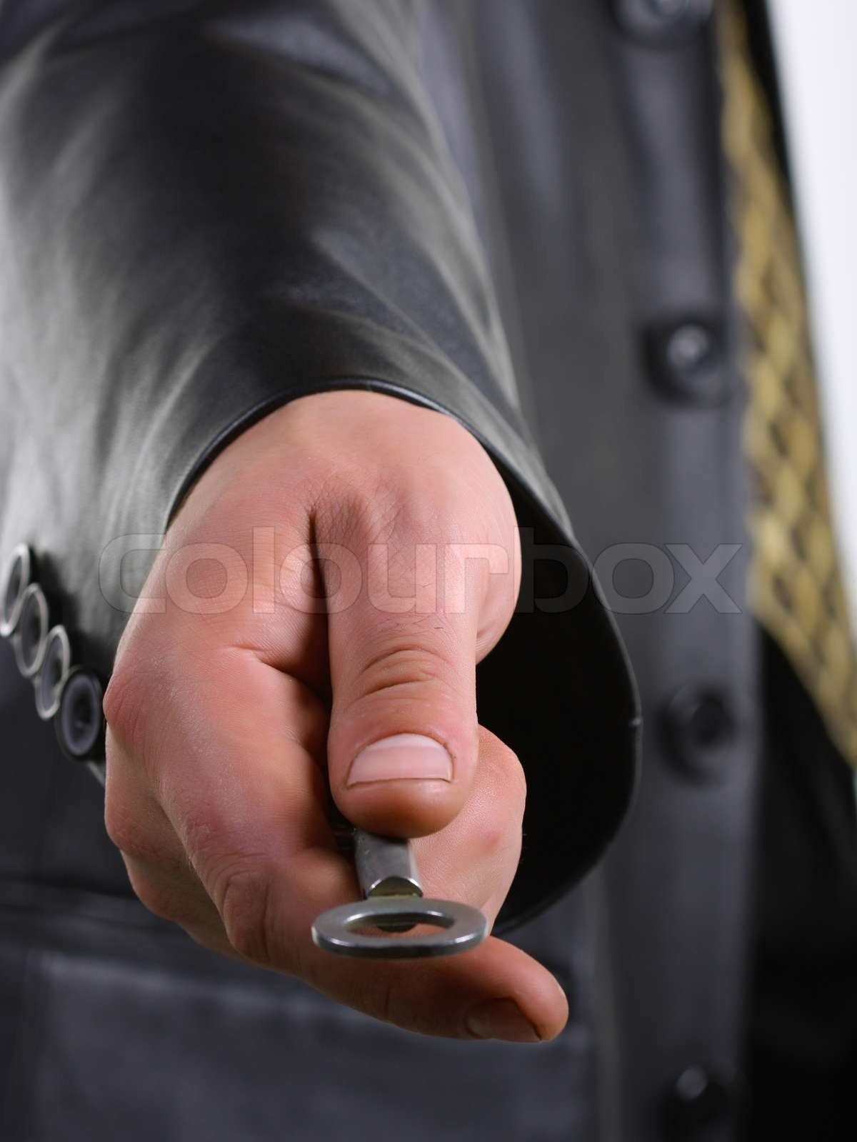 Man with key on hand | Stock image | Colourbox