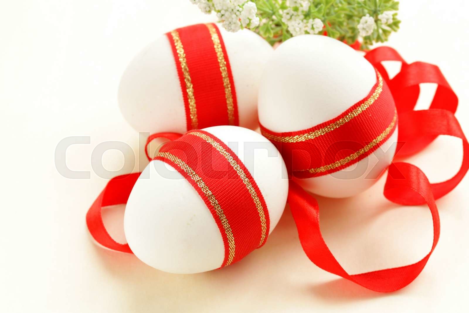 festive eggs with red ribbon | Stock image | Colourbox