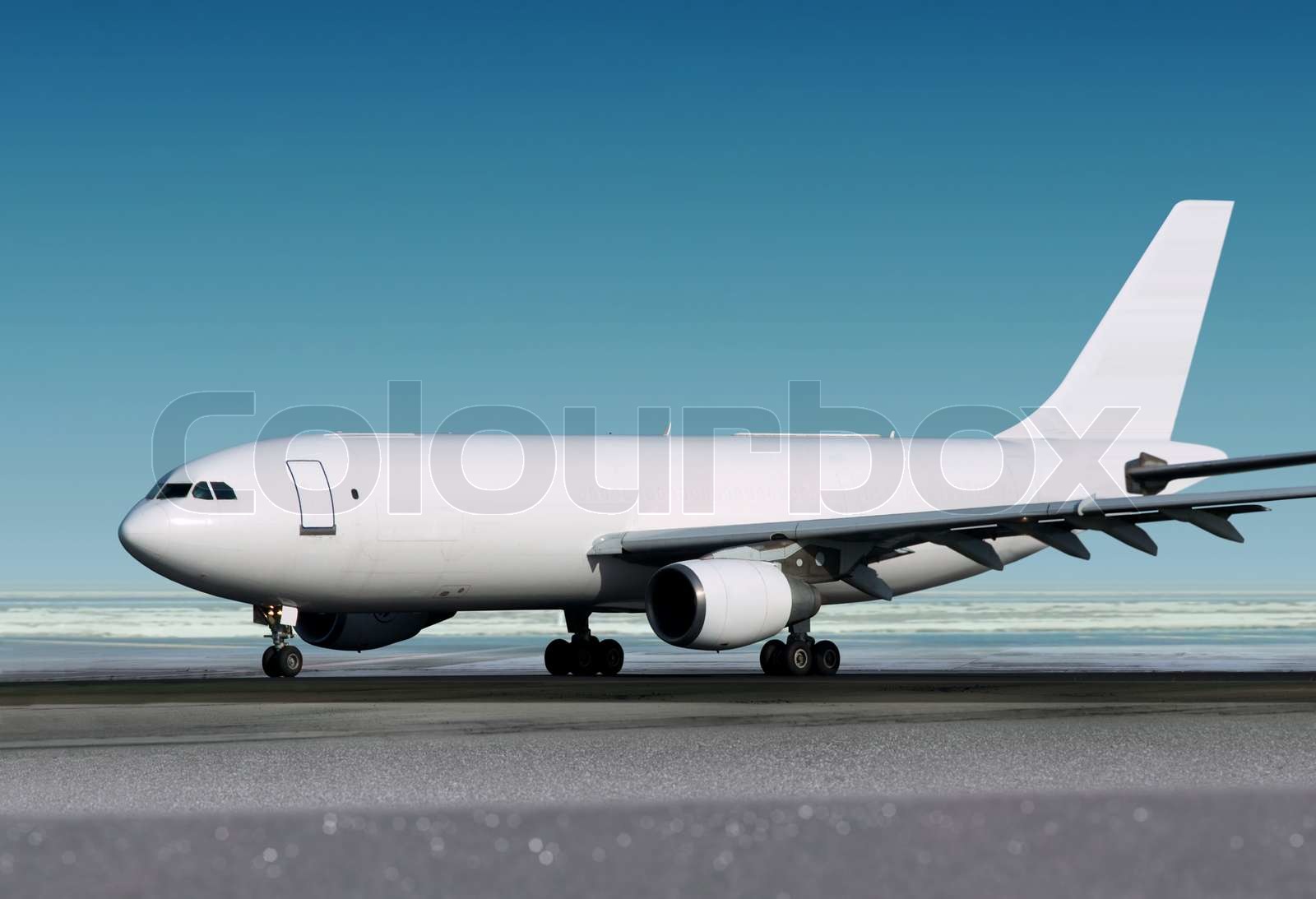small cargo airplane is landing to runway of airport | Stock image ...