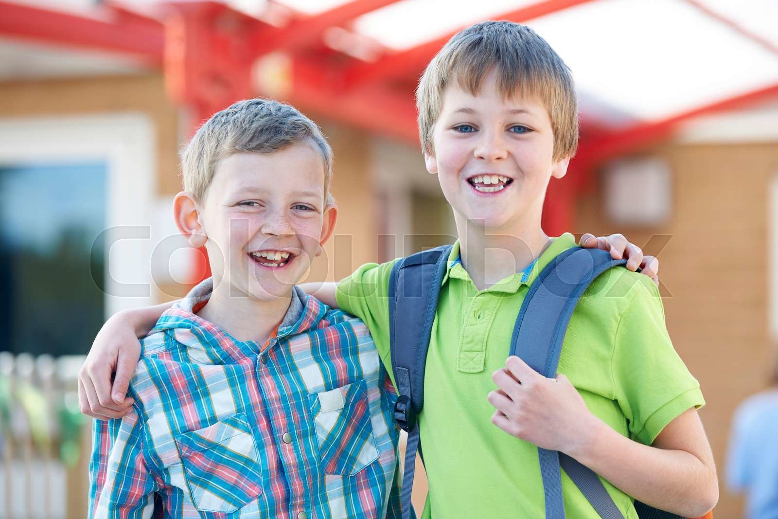 Two Boys Standing Outside School With Book Bags | Stock image | Colourbox