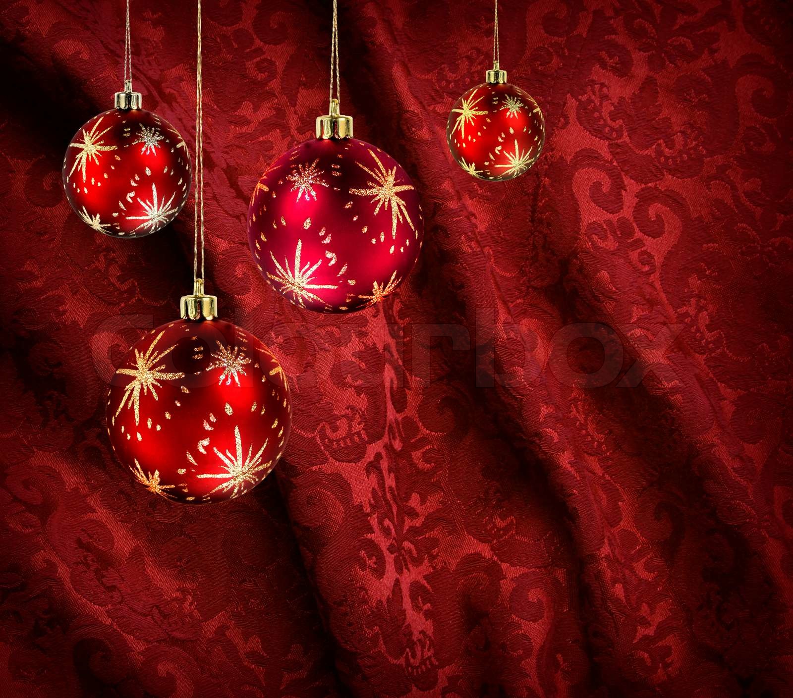 Red christmas balls on red velvet background | Stock image | Colourbox