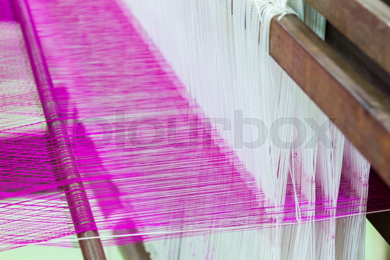 Silk weaving | Stock image | Colourbox