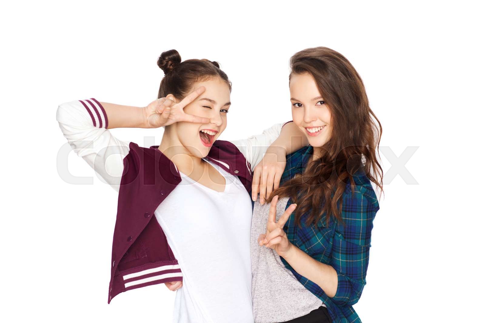 happy pretty teenage girls showing peace hand sign | Stock image ...