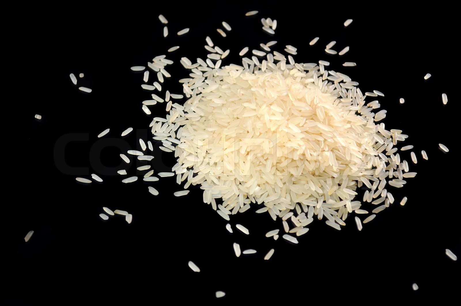 Pile of Parboiled Rice on Black Background | Stock image | Colourbox