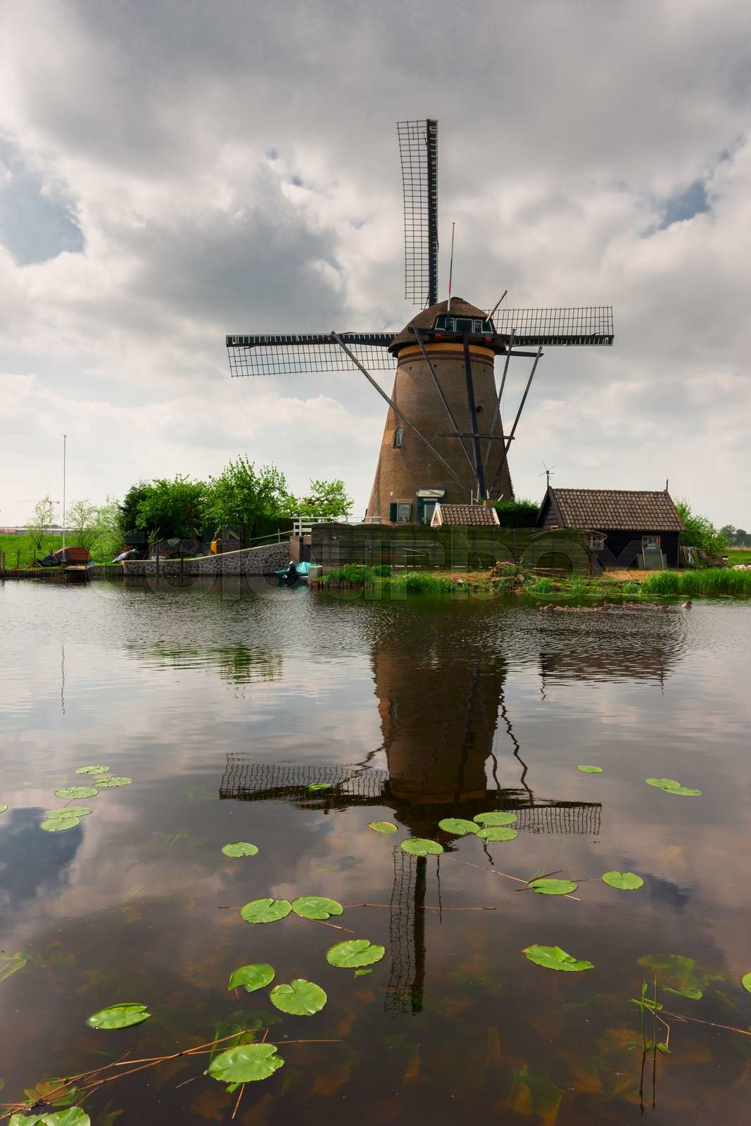 dutch windmill over water | Stock image | Colourbox