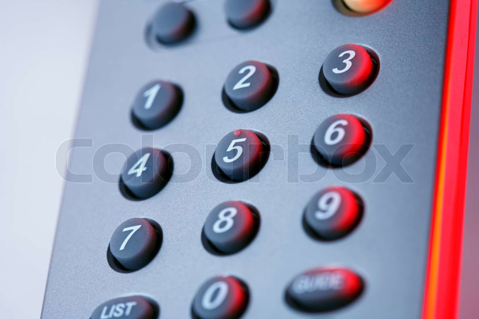 Remote control buttons in red light | Stock image | Colourbox