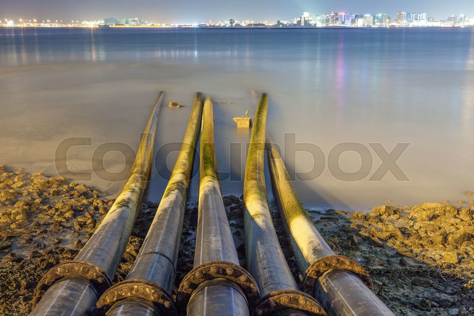 Sewage pipes in the sea in Doha, Qatar | Stock image | Colourbox