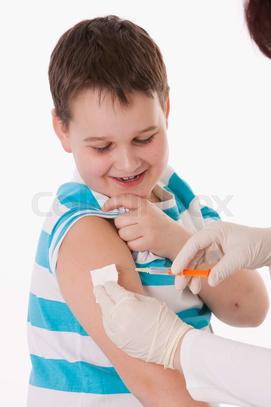 Doctor giving a child injection in arm on isolated image. | Stock image ...