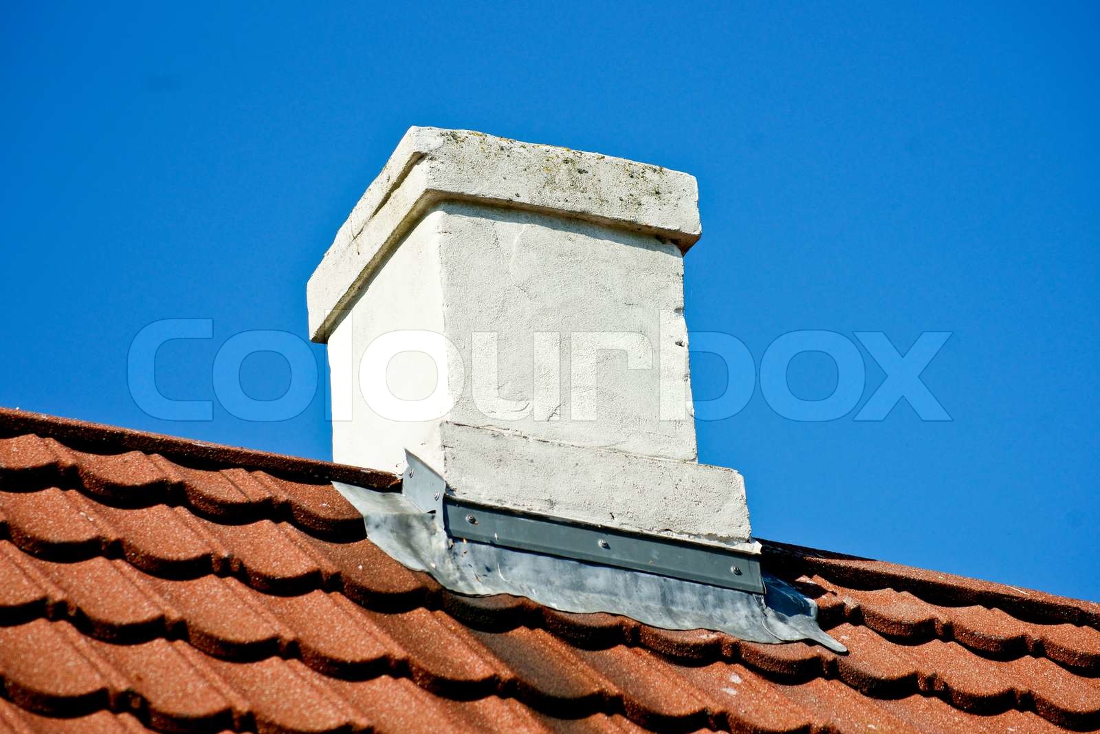 White chimney on a rooftop | Stock image | Colourbox