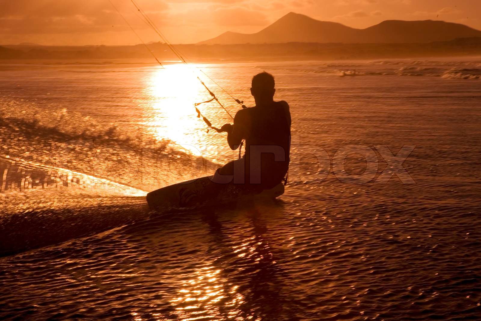 Kite surfer, ocean and sunset | Stock image | Colourbox