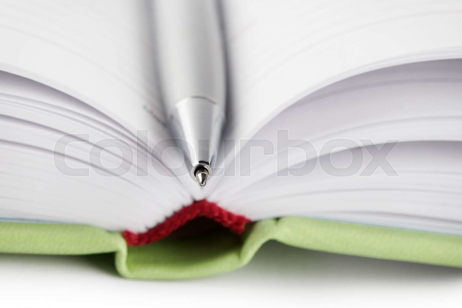 Detail of an open diary with pen | Stock image | Colourbox