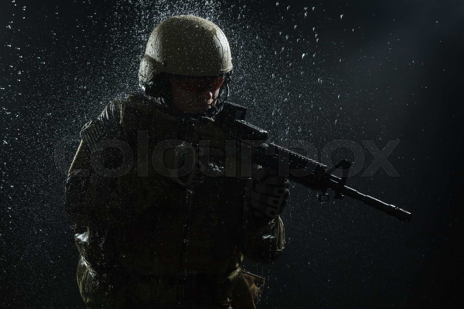 US Army soldier in the rain | Stock image | Colourbox