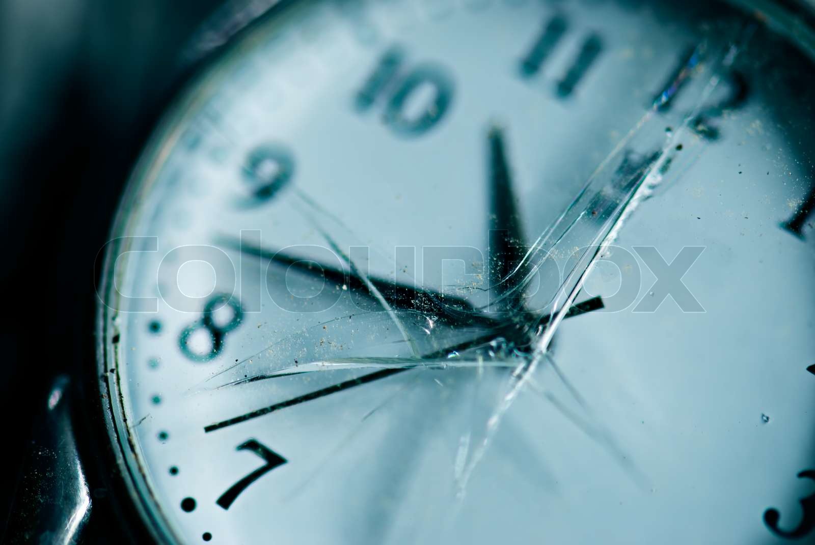 Broken time concept. Old dusty pocket clock with broken glass. Shallow ...